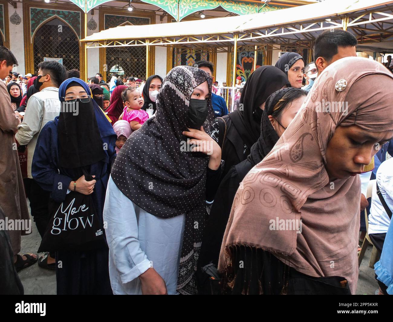 Muslim females leaving the Golden Mosque after listening to the sermon ...