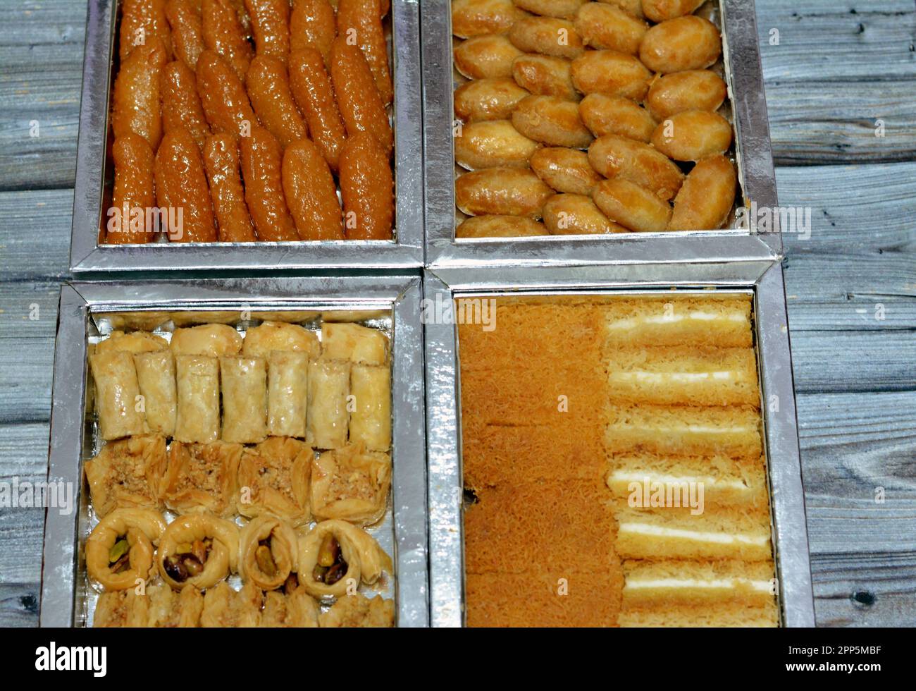 Different types of Eastern sweets of Baklava covered and stuffed with ...