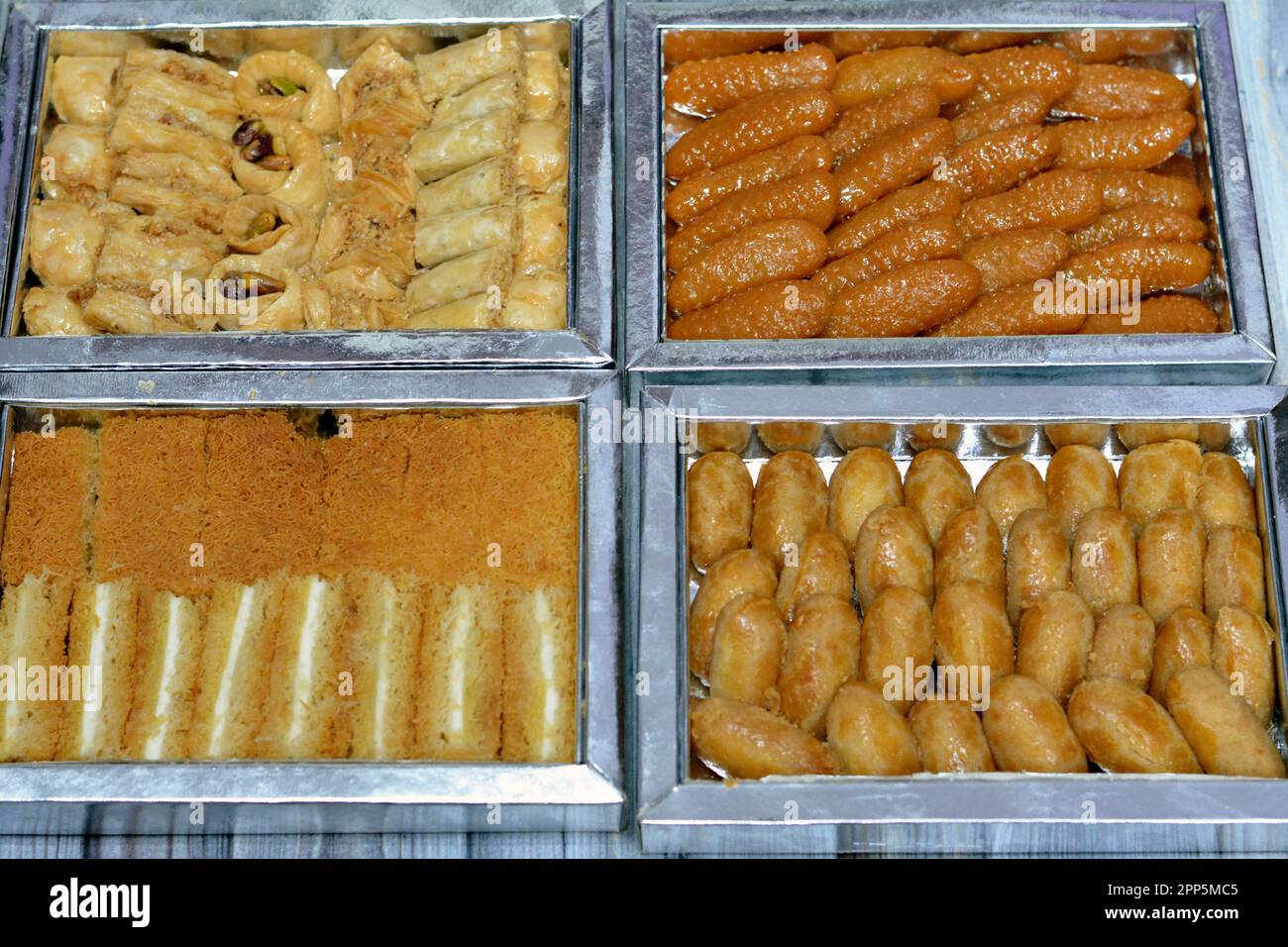 Different types of Eastern sweets of Baklava covered and stuffed with ...