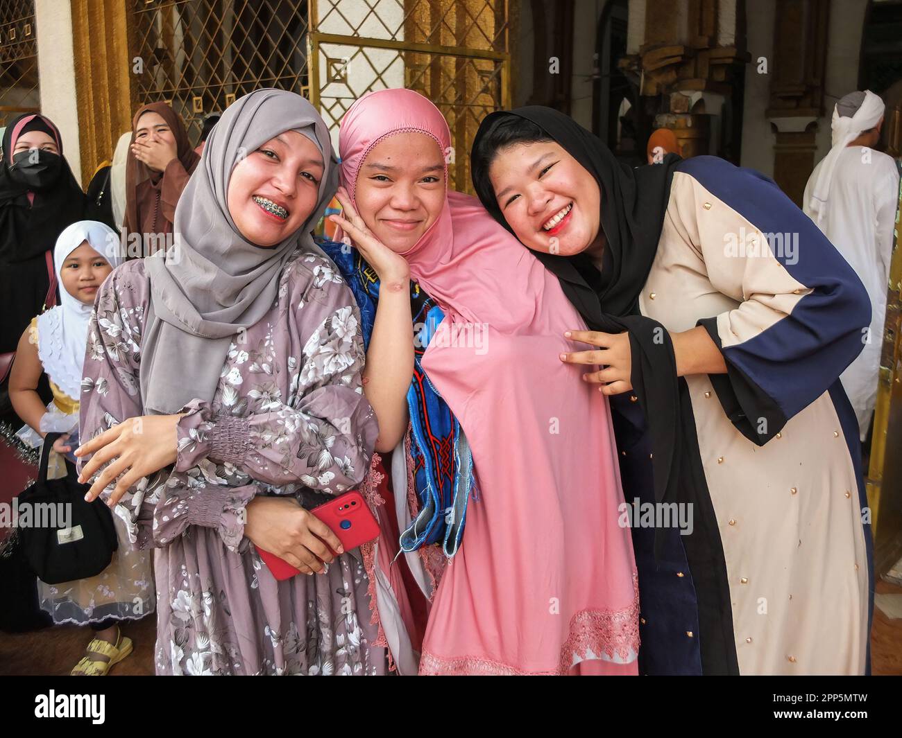 Muslim ladies pose for a photo after prayers at Golden Mosque in Quiapo ...