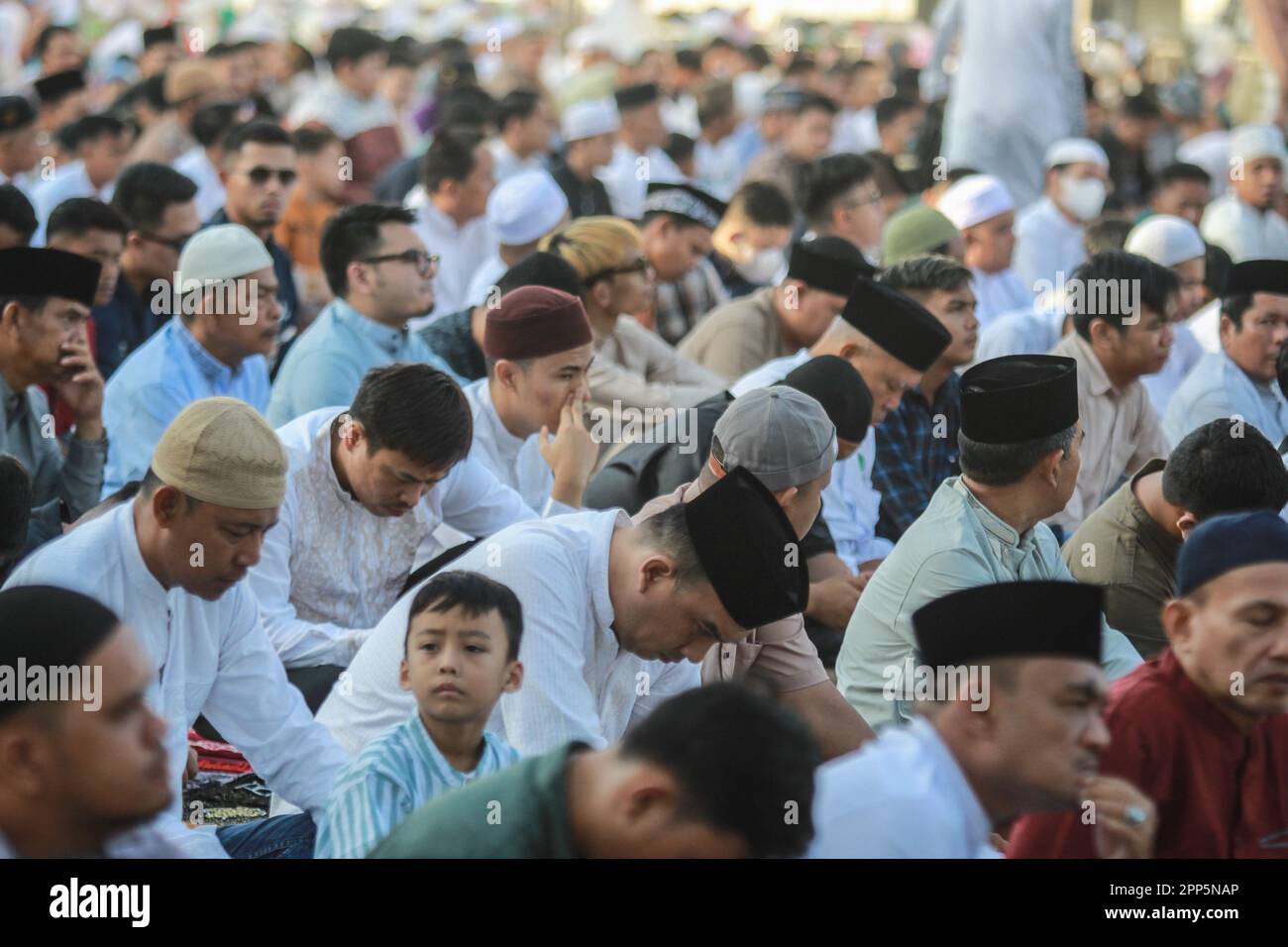 Muslims attend Eid al-Fitr prayers at the Al-Mashun Mosque in Medan ...