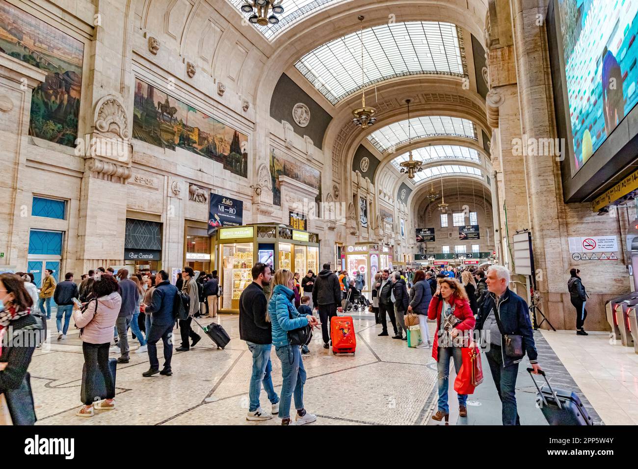 People walking through the magnificent interior of the ground level ...