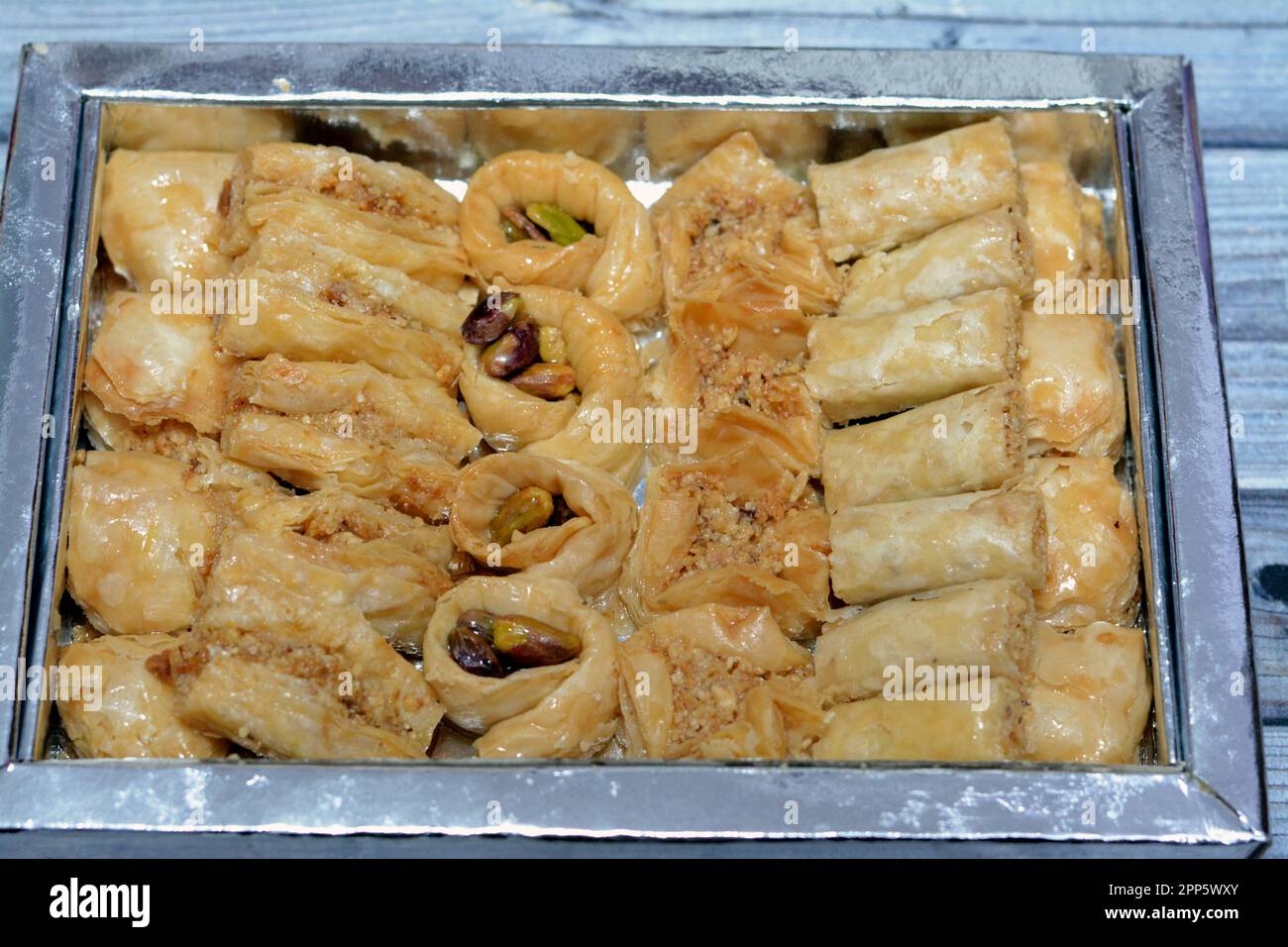 Different shapes of Baklava covered and stuffed with pistachios and ...