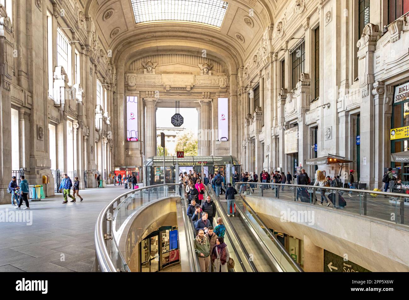 People on an escalator inside the magnificent interior of the ground ...