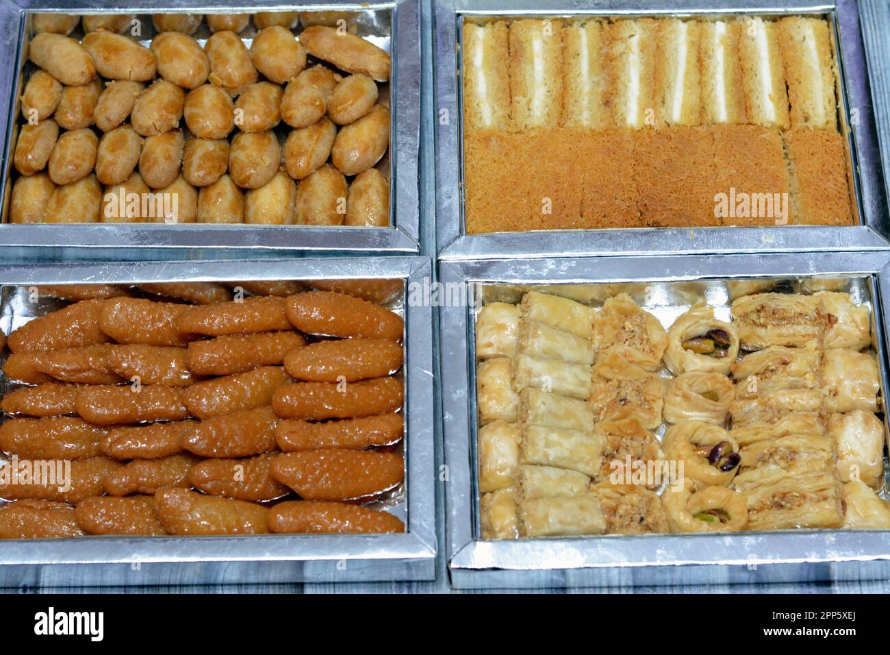 Different types of Eastern sweets of Baklava covered and stuffed with ...