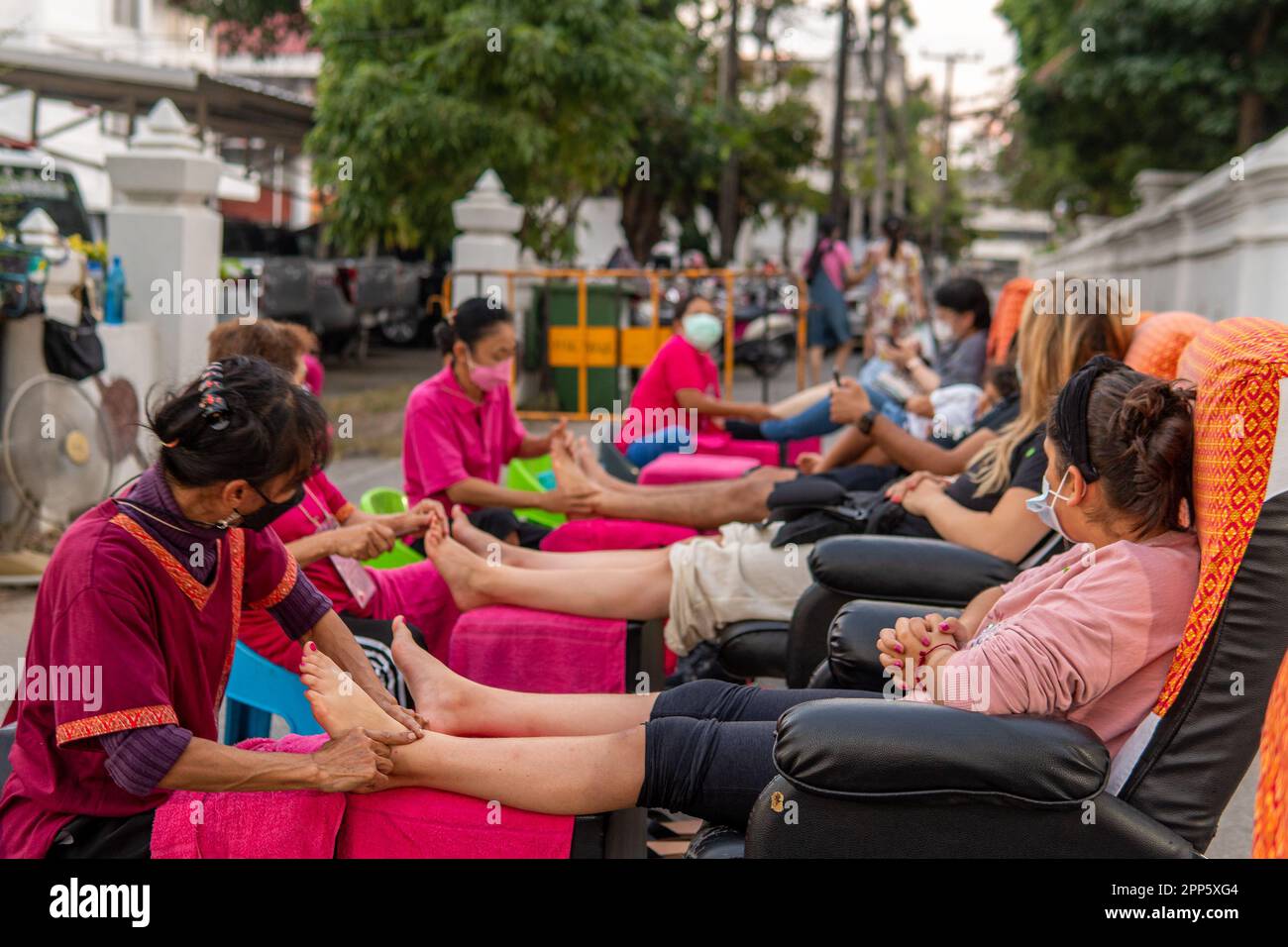 Thai foot massage on the street of Chiang Mai Stock Photo - Alamy