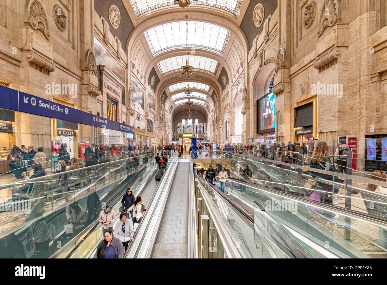 Rail passengers inside the main hall or galleria commerciale in Milano ...