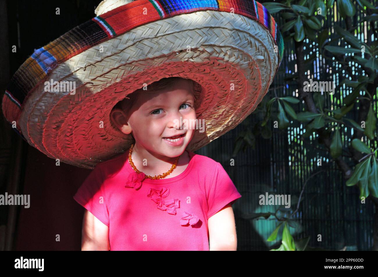 Little girl in a sombrero Stock Photo - Alamy