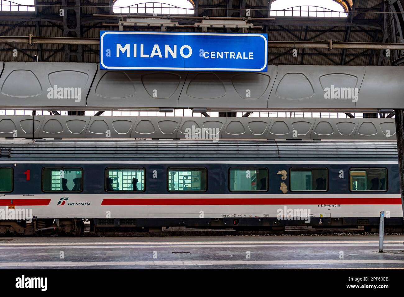 A large blue Milano Centrale sign hanging above the platform at at ...