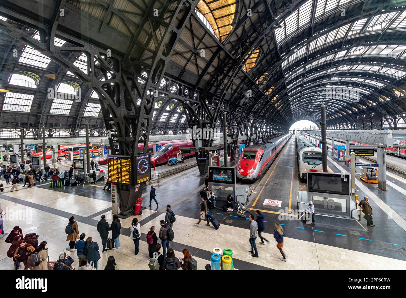 Rail passengers walking through the main concourse of Milano Centrale ...