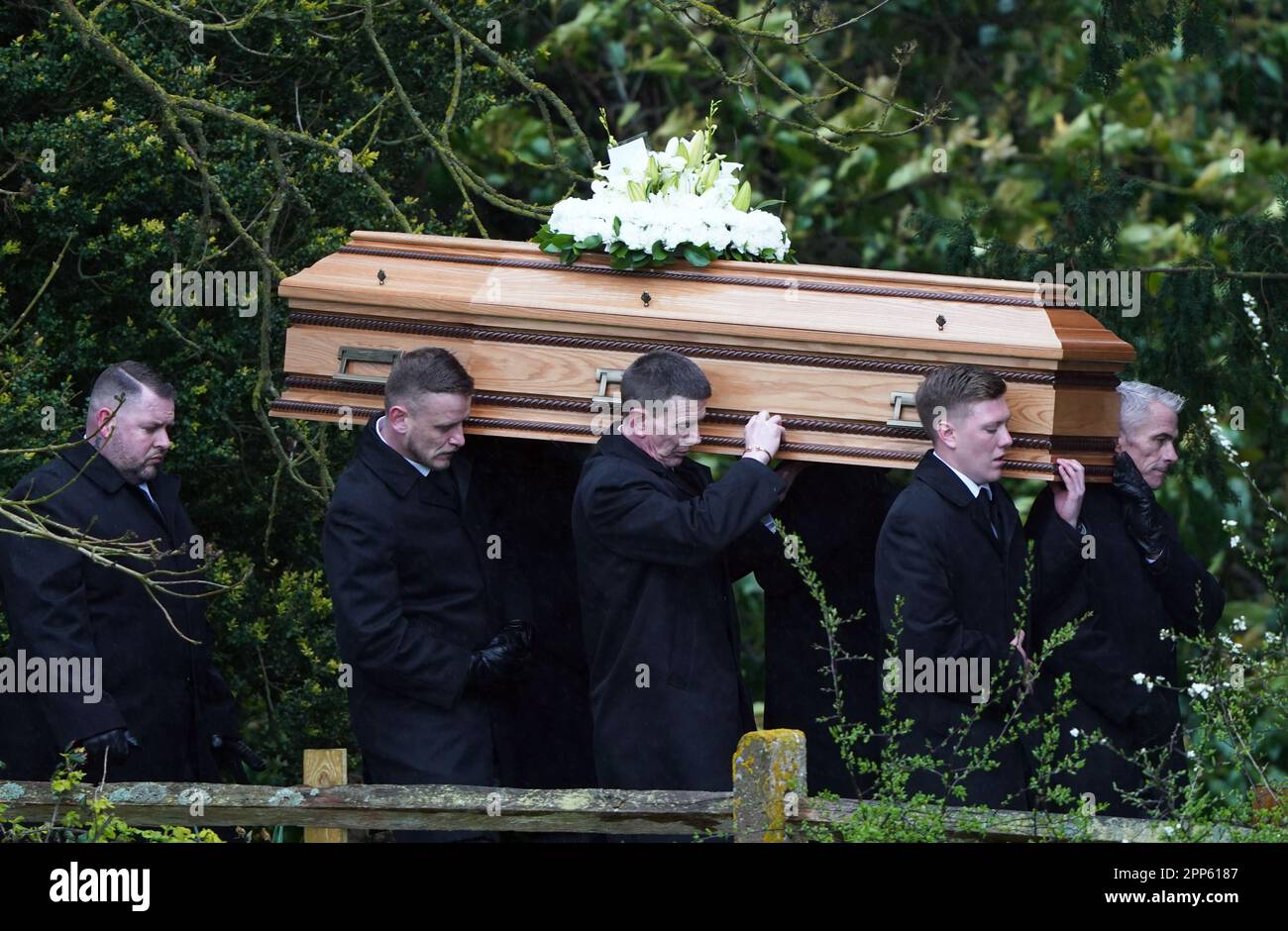 The coffin of Paul O'Grady is taken from St Rumwold's Church in Aldington, Kent, following his ...