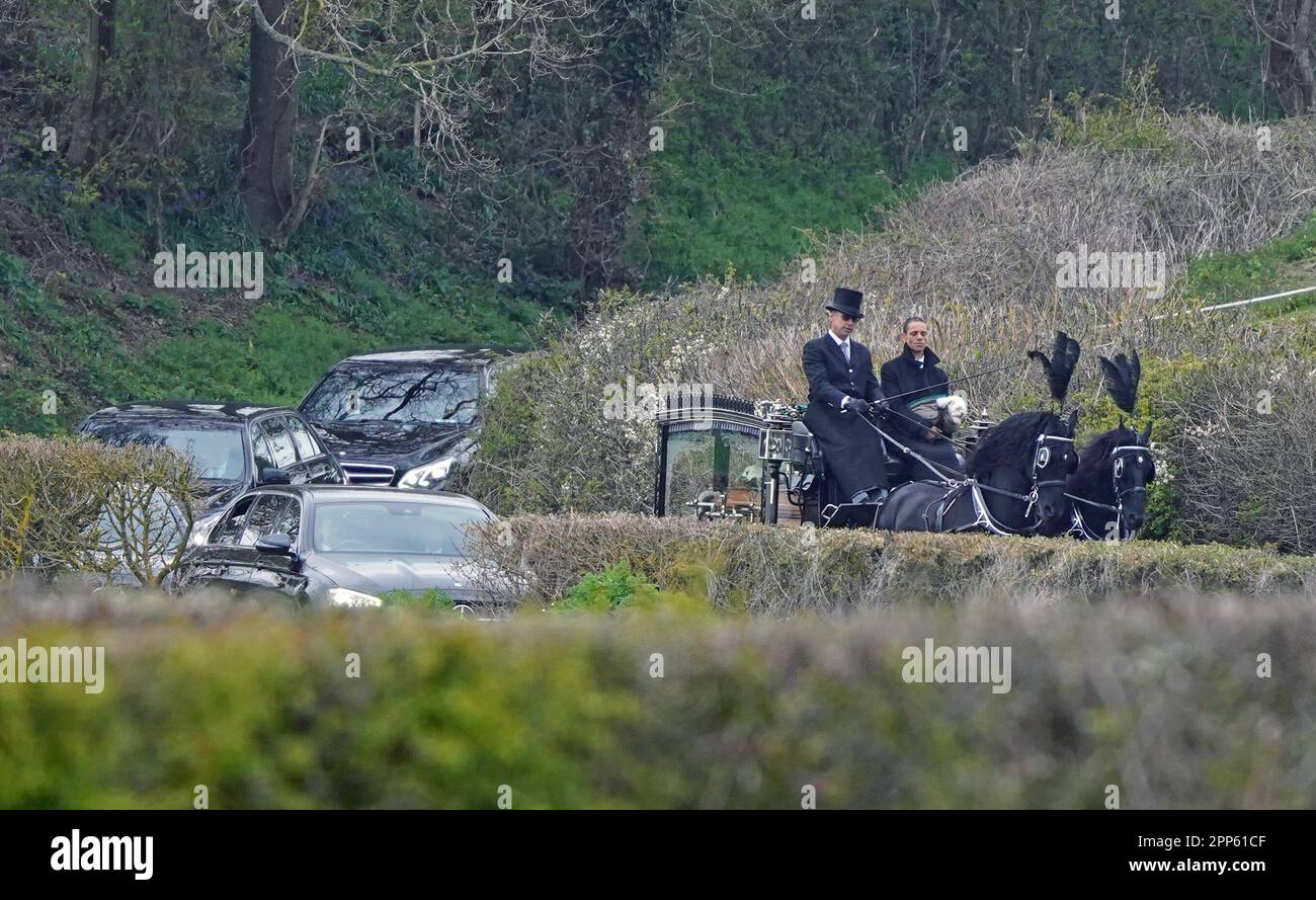 Husband of Paul O'Grady, Andre Portasio, carrying one of their dogs ...