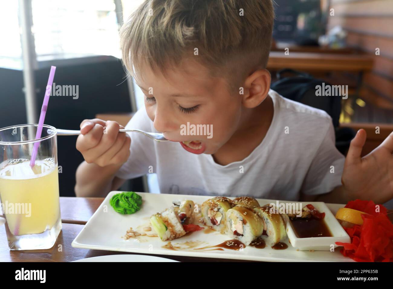 Boy eating sushi boy hi-res stock photography and images - Alamy