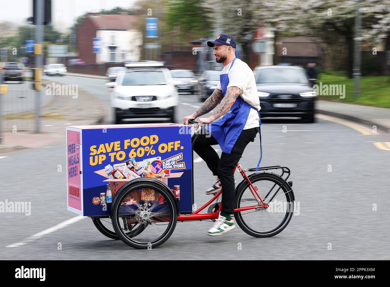 EDITORIAL USE ONLY Jake Quickenden helps distribute 580 meals in ...