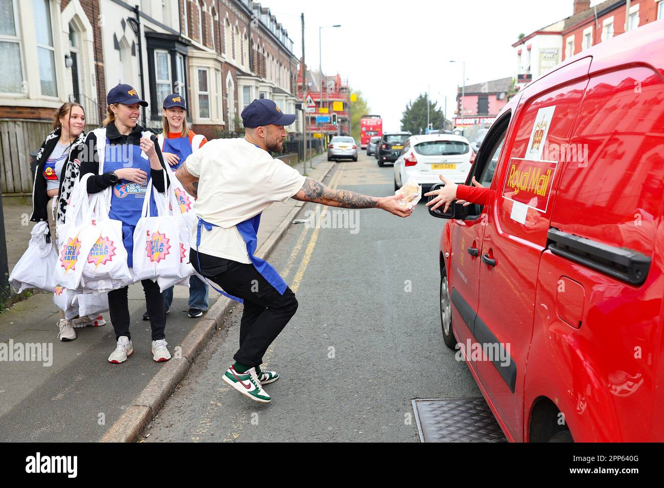 EDITORIAL USE ONLY Jake Quickenden helps distribute 580 meals in ...