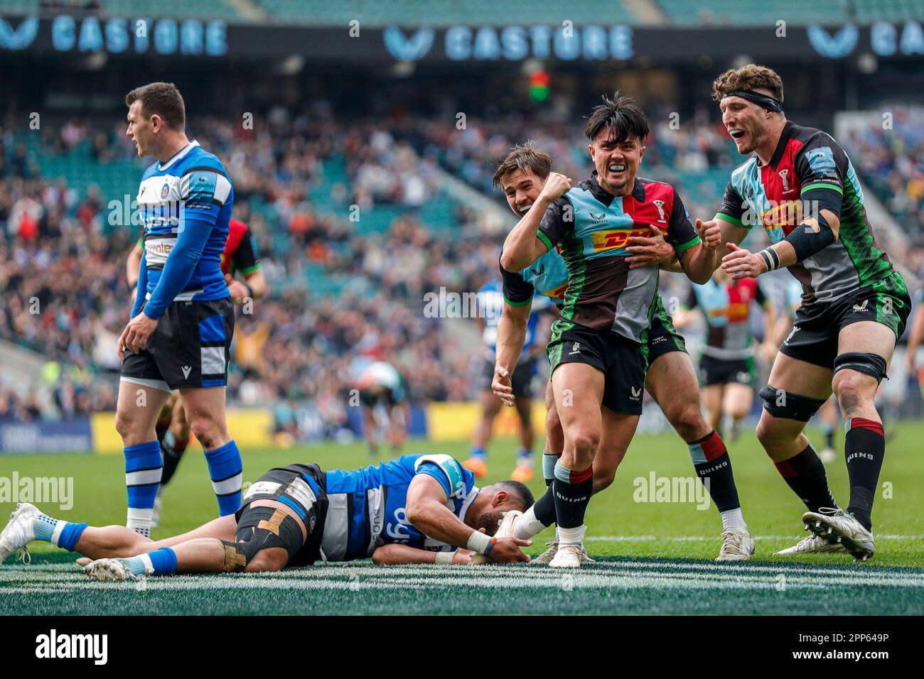 Harlequins' Marcus Smith celebrates after scoring a try with Lewis ...