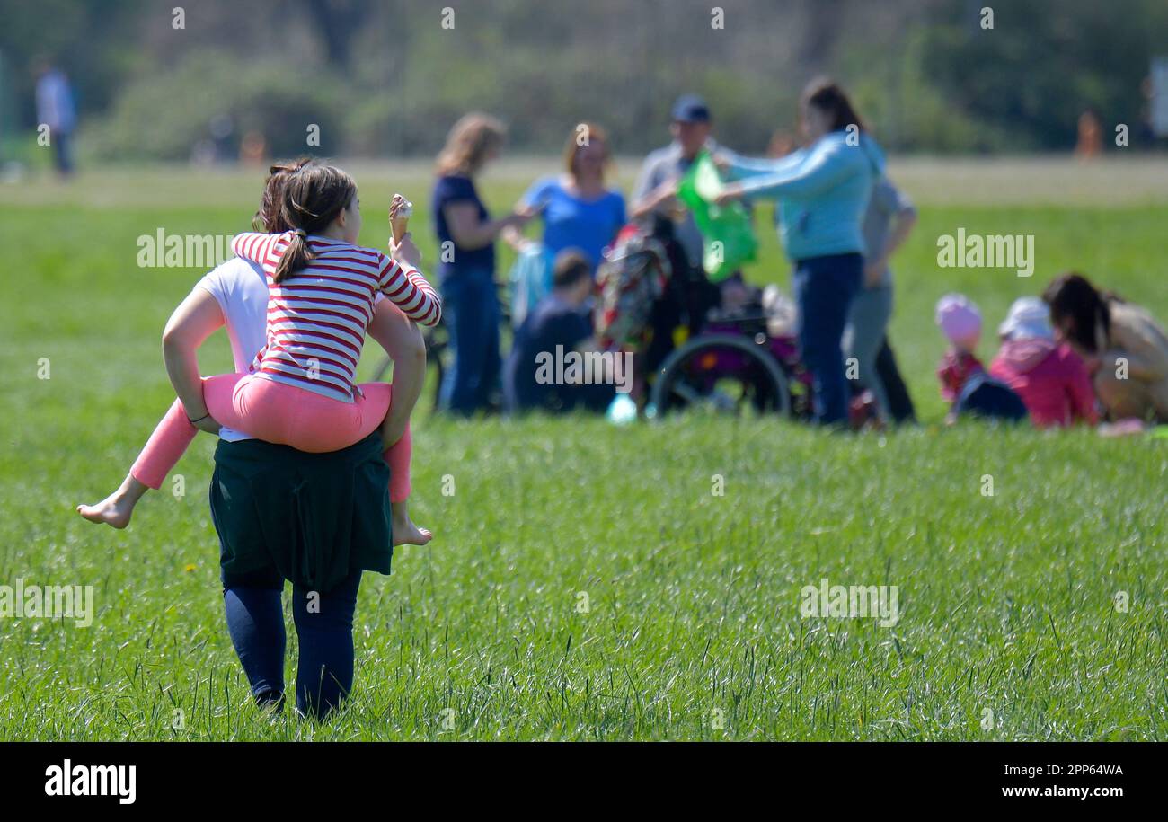 22 April 2023, Saxony, Dresden: People cavort at temperatures of 18 ...