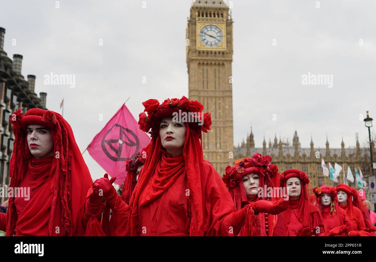 Members of the Red Rebel Brigade join Extinction Rebellion demonstrators in Westminster, London ...