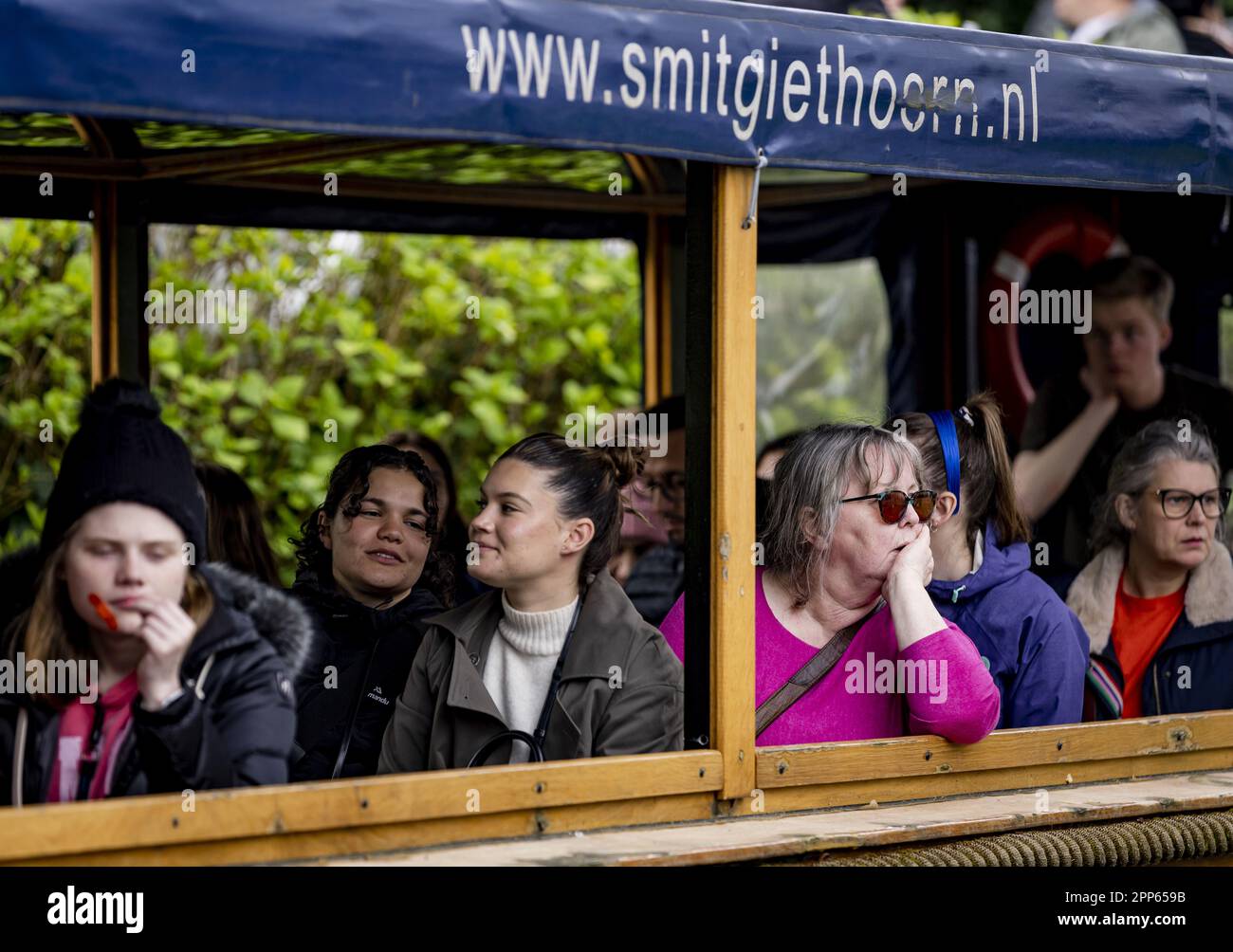 GIETHOORN - Tourists sail in a tour boat through Giethoorn during the ...