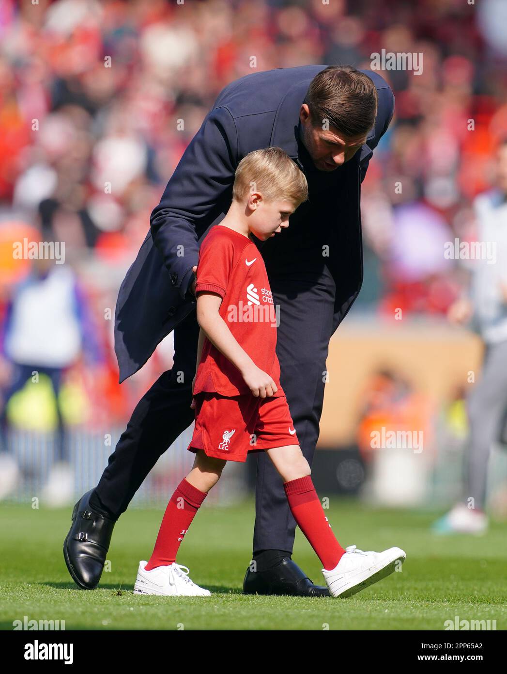 Former Liverpool player Steven Gerrard with his son Lio at half time ...