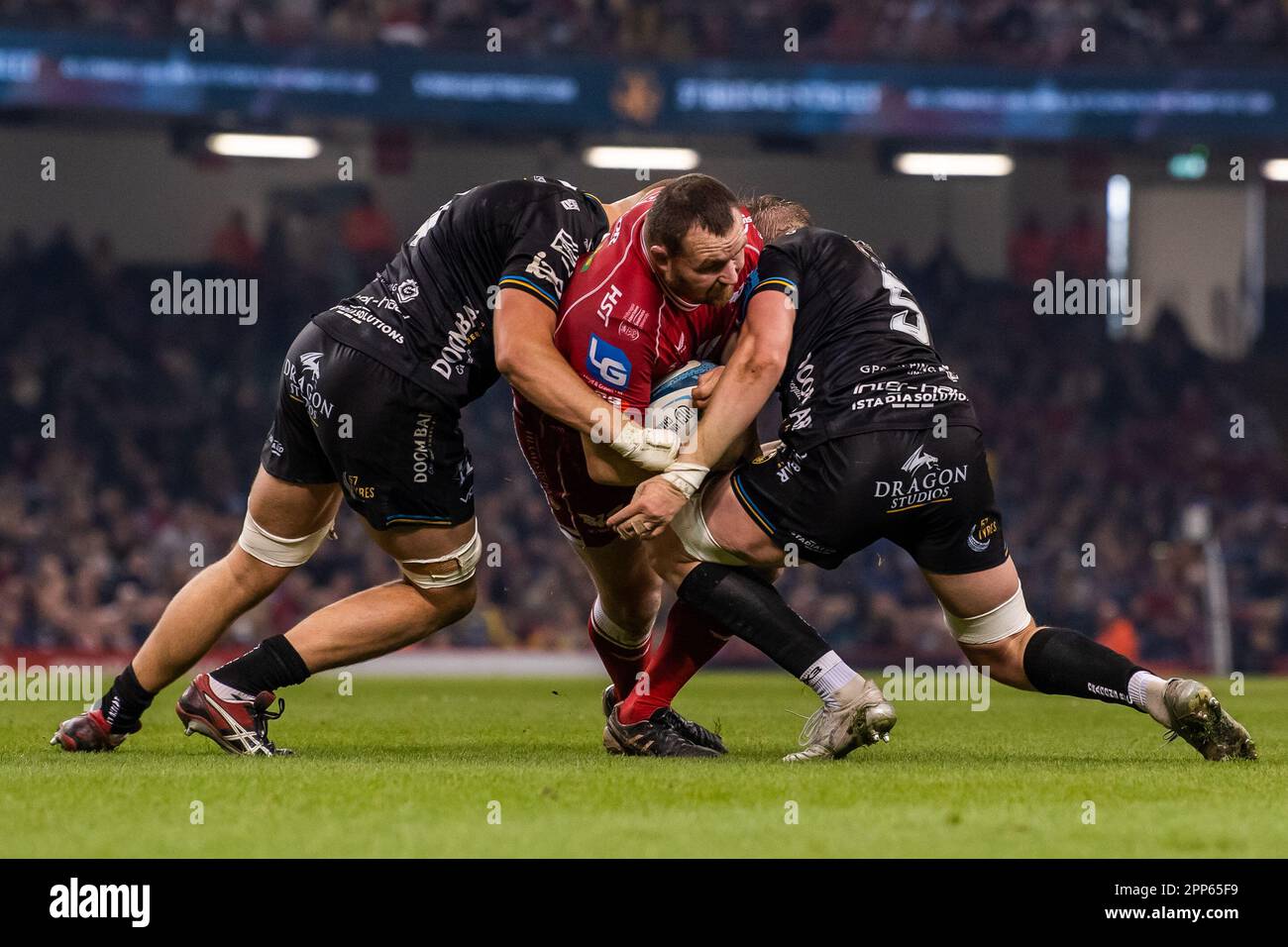 Ken Owens of Scarlets is tackled by Matthew Screech and George Nott of ...