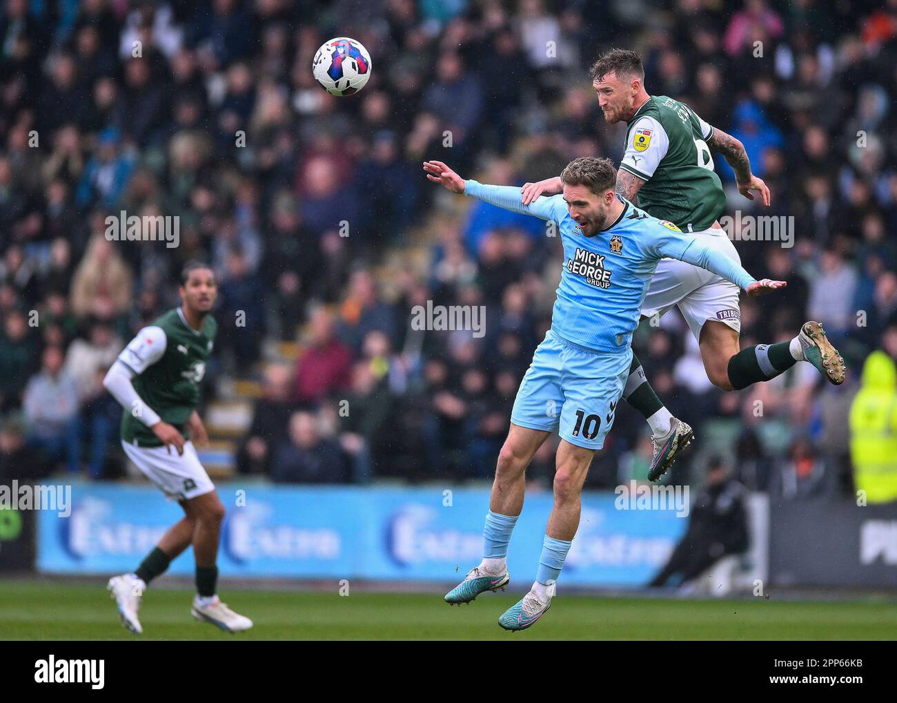 Dan Scarr #6 of Plymouth Argyle wins aerial ball during the Sky Bet ...