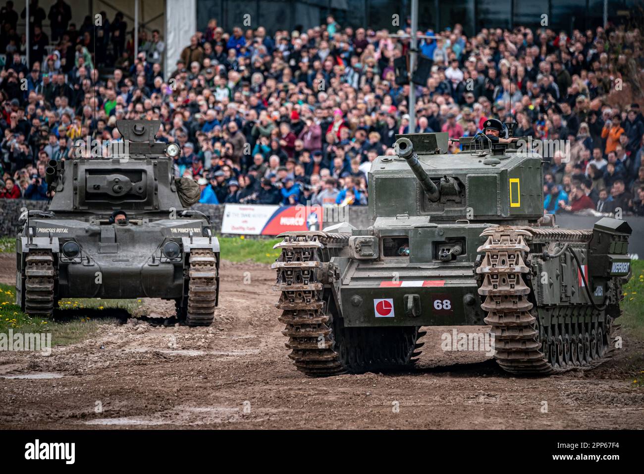 A British Churchill tank (right) drives around the tank course at the ...