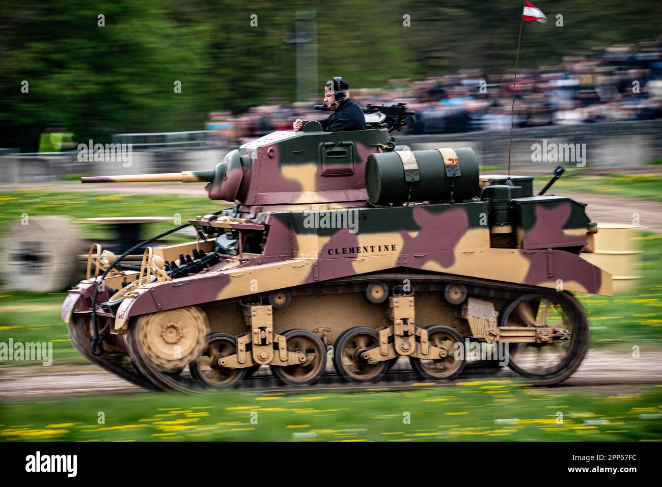 A Stuart light tank drives around the tank course at the Tank Museum in ...