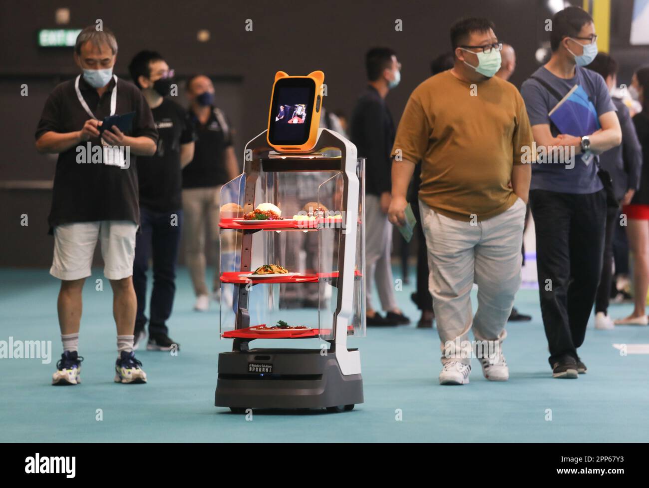 A catering robot is seen at the exhibition hall during the first day of ...