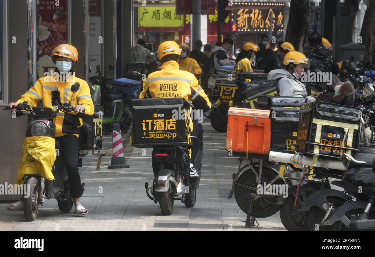 Food delivery riders of Meituan deliver takeaway food to customers on ...
