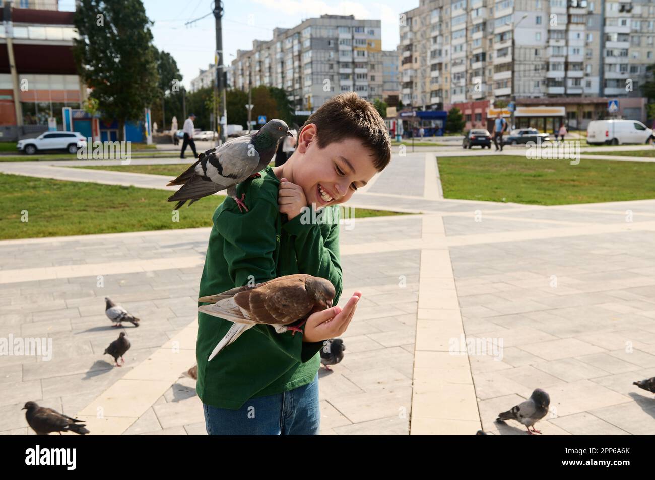 Smiling adorable Caucasian teen boy, expressing positive emotions while ...
