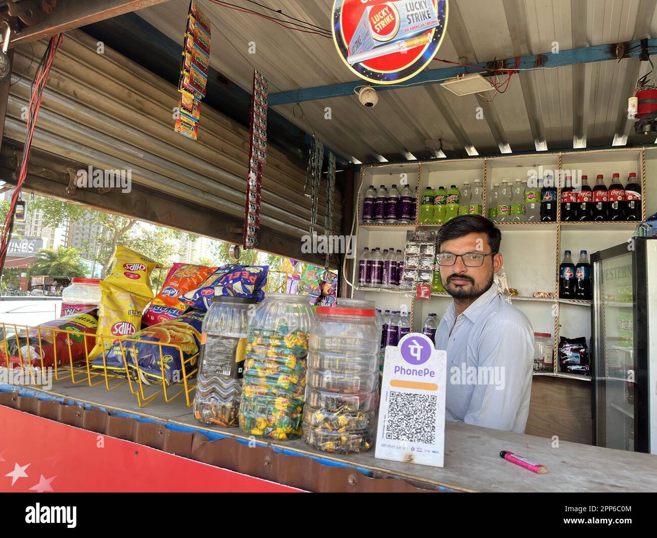 A QR code sign at a streetside paan shop in Gurugram, India. SCMP / Amy ...