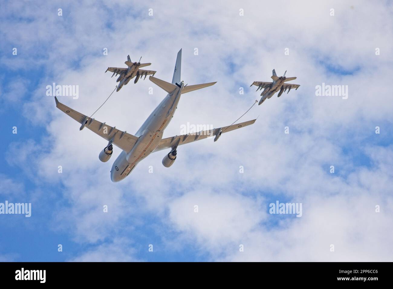 A stunning aerial view of three jet airliners flying through a ...