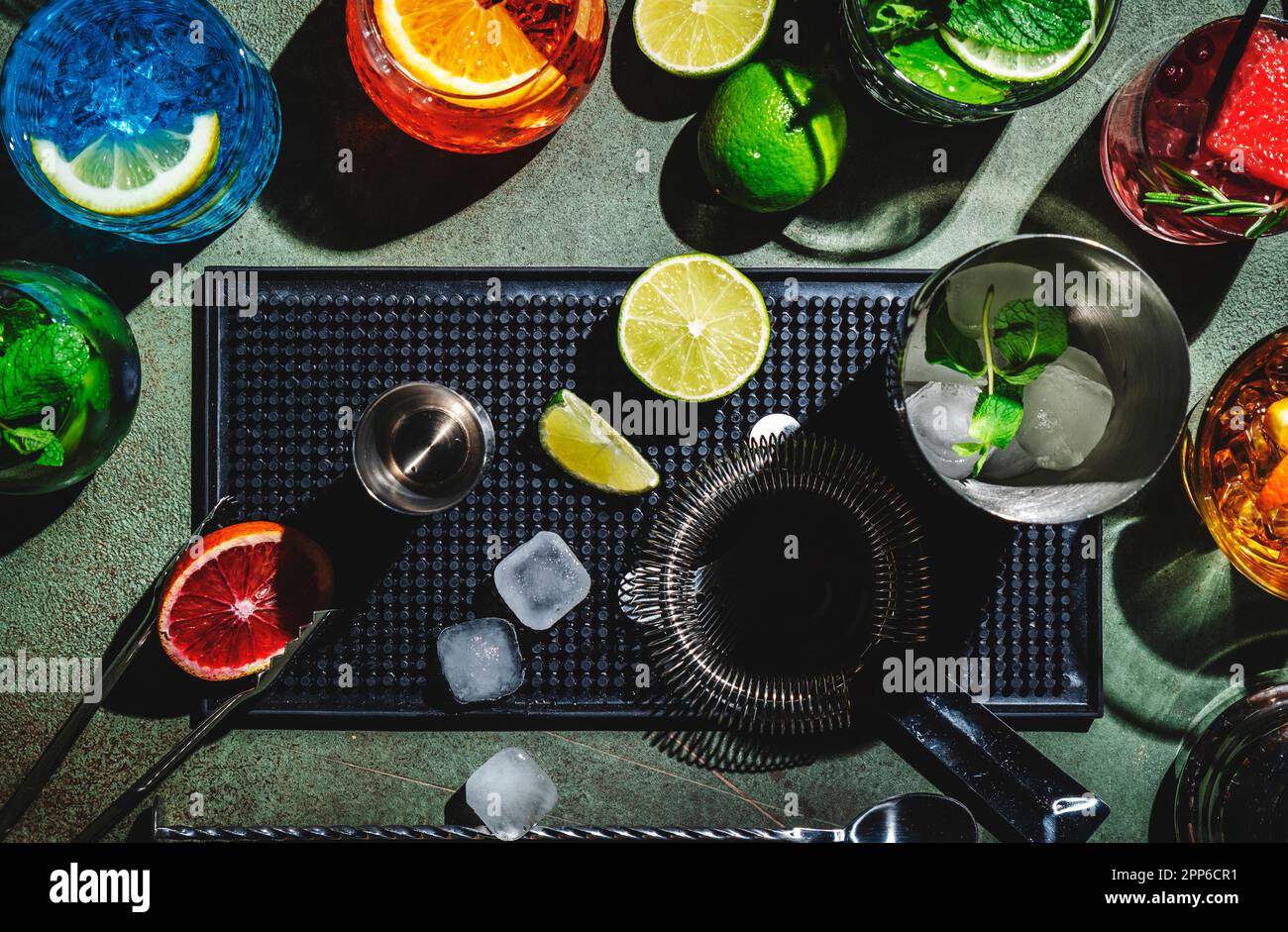 Cocktails set on rusty green bar counter, top view. Mixology concept ...