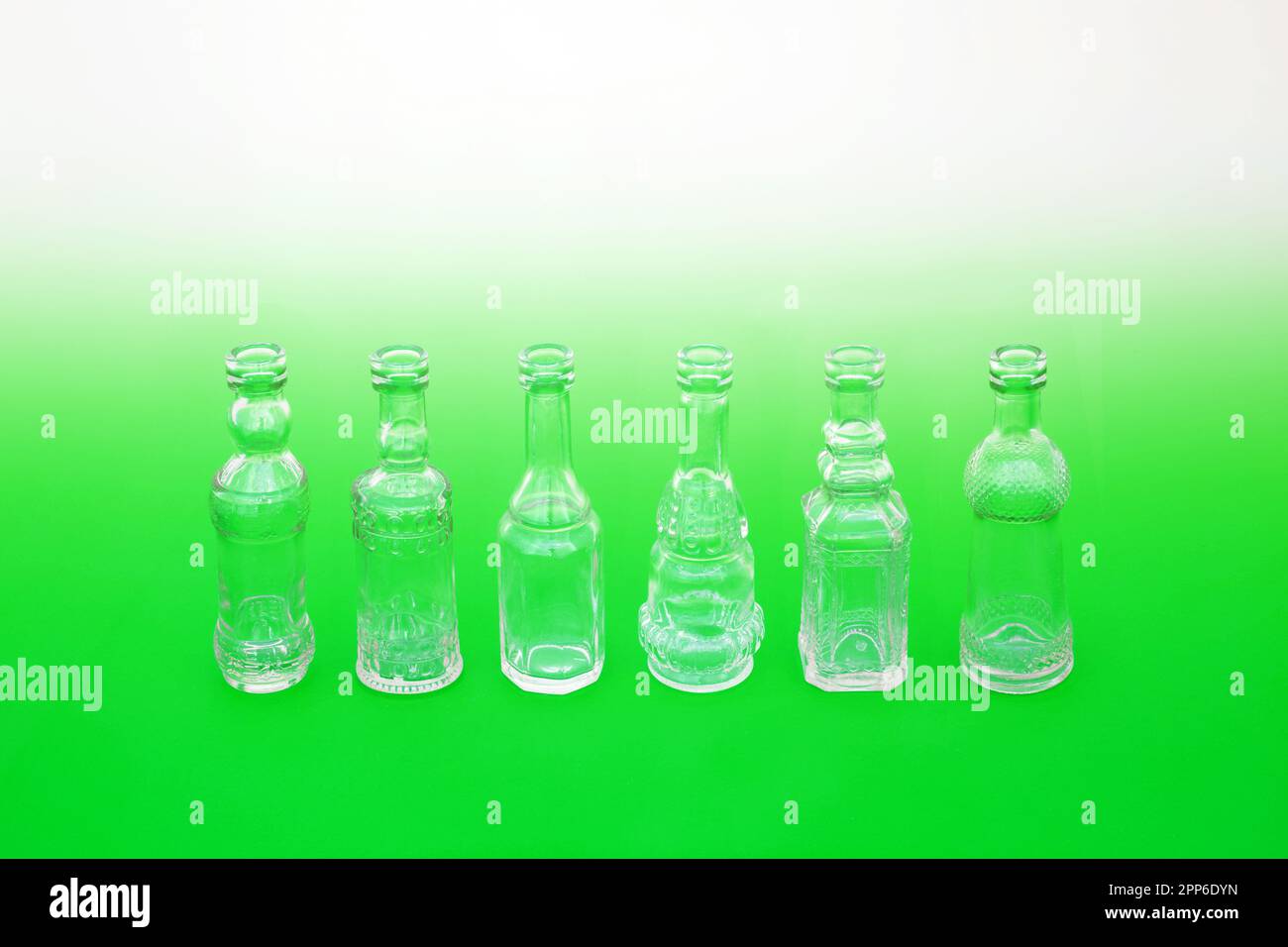 Go green use recycled glass bottles not plastic concept with line of ...