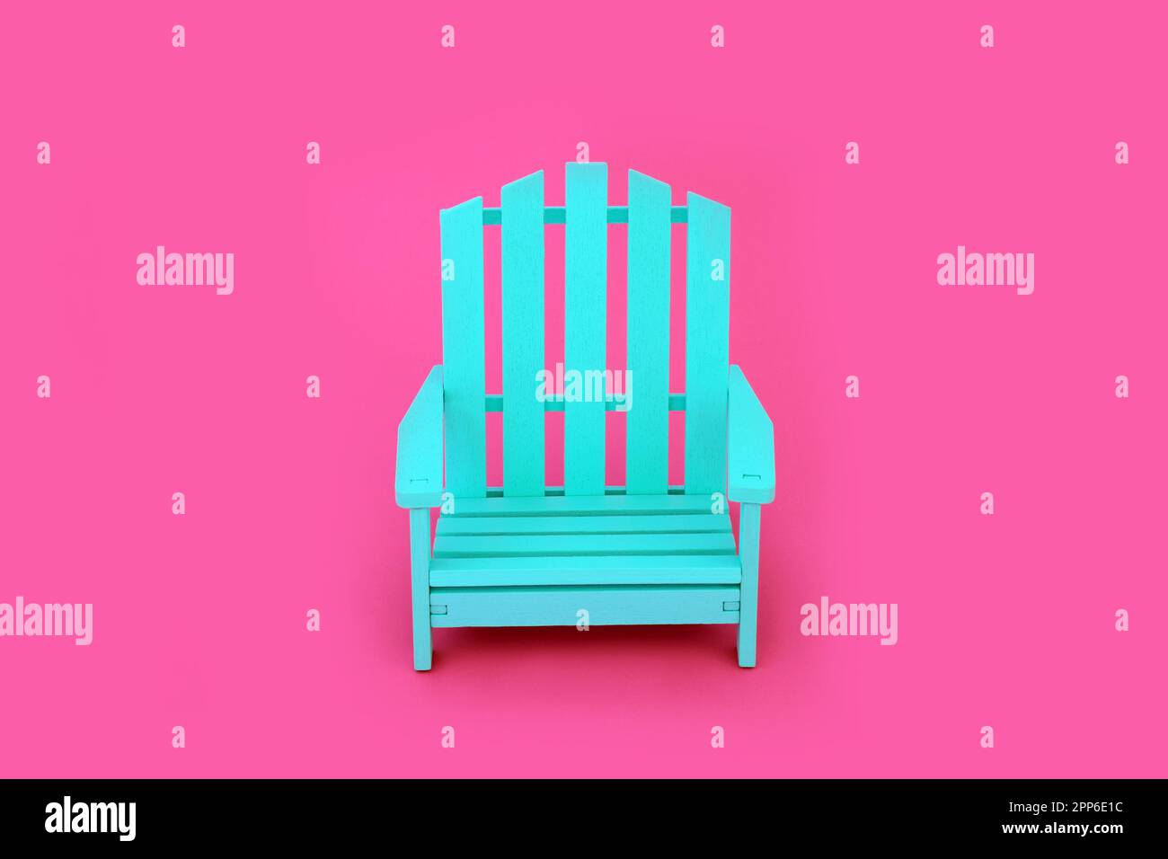 Trendy solitary slatted wooden blue chair on vivid pink background ...
