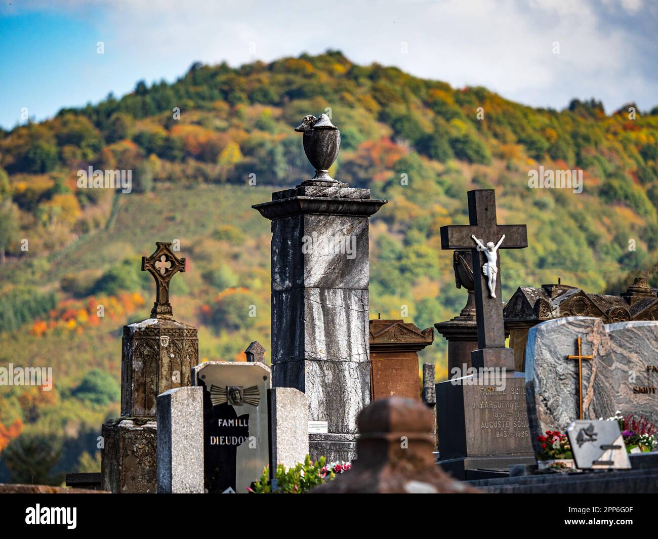 Old rickety stone monuments in the cemetery. Geometric chaos of crosses ...