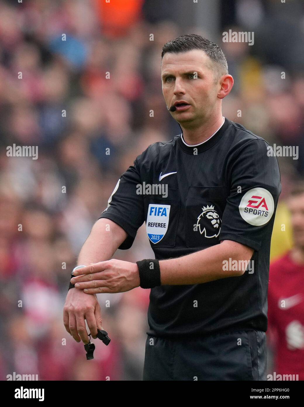 Referee Michael Oliver points to his watch during the Premier League ...