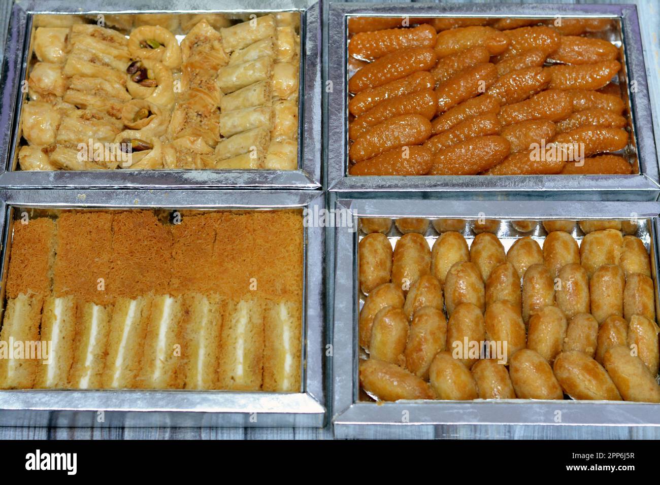 Different types of Eastern sweets of Baklava covered and stuffed with ...