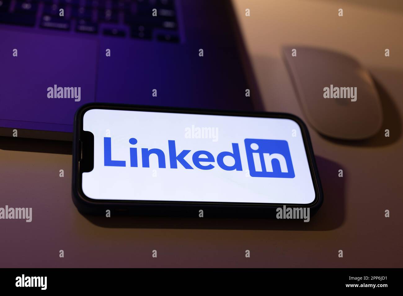 In this photo illustration a Linkedin logo seen displayed on a mobile ...