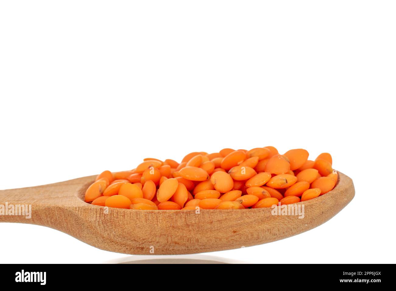 Red lentils with wooden spoon, macro, isolated on white background Stock Photo - Alamy
