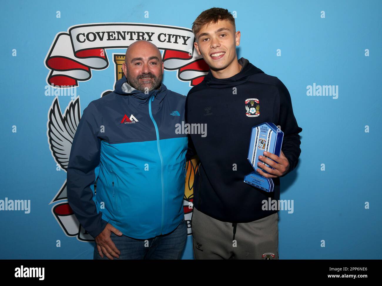 Coventry City's Callum Doyle (right) with the Man of the Match award ...