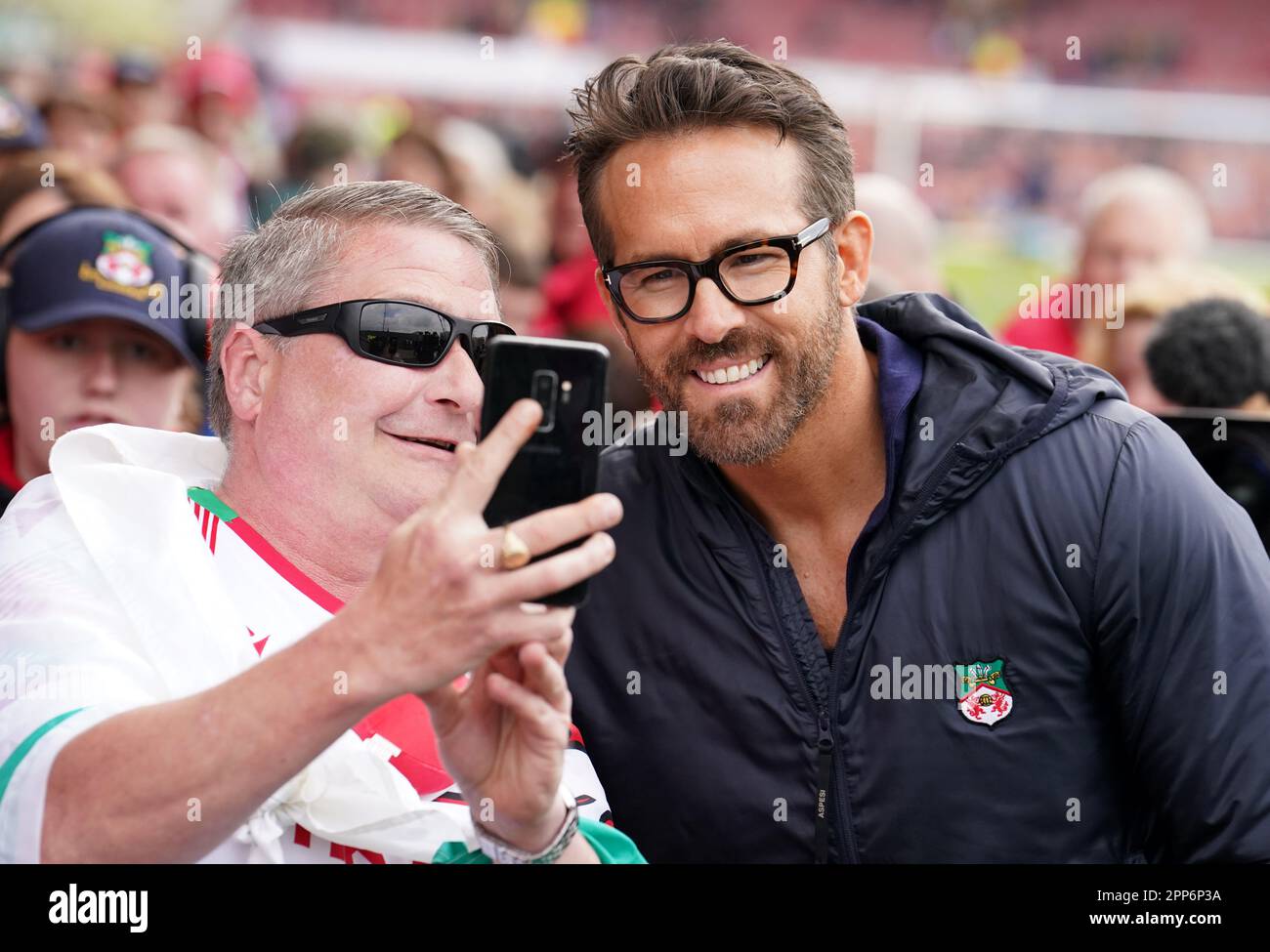 Wrexham co-owner Ryan Reynolds poses with fans ahead of the Vanarama ...