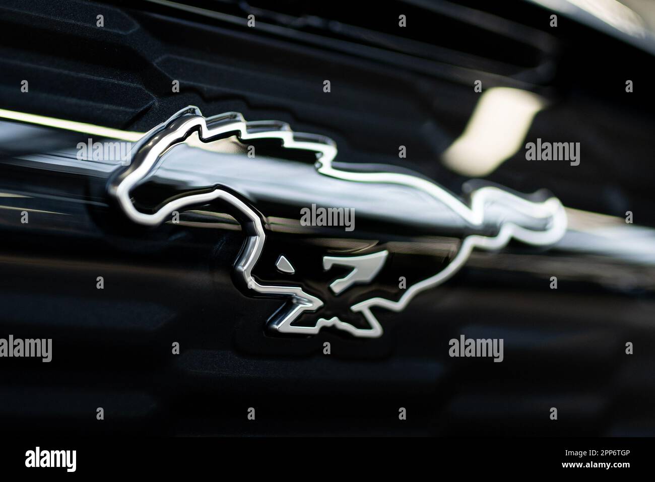 In this photo illustration, a Ford Mustang logo seen displayed on an ...