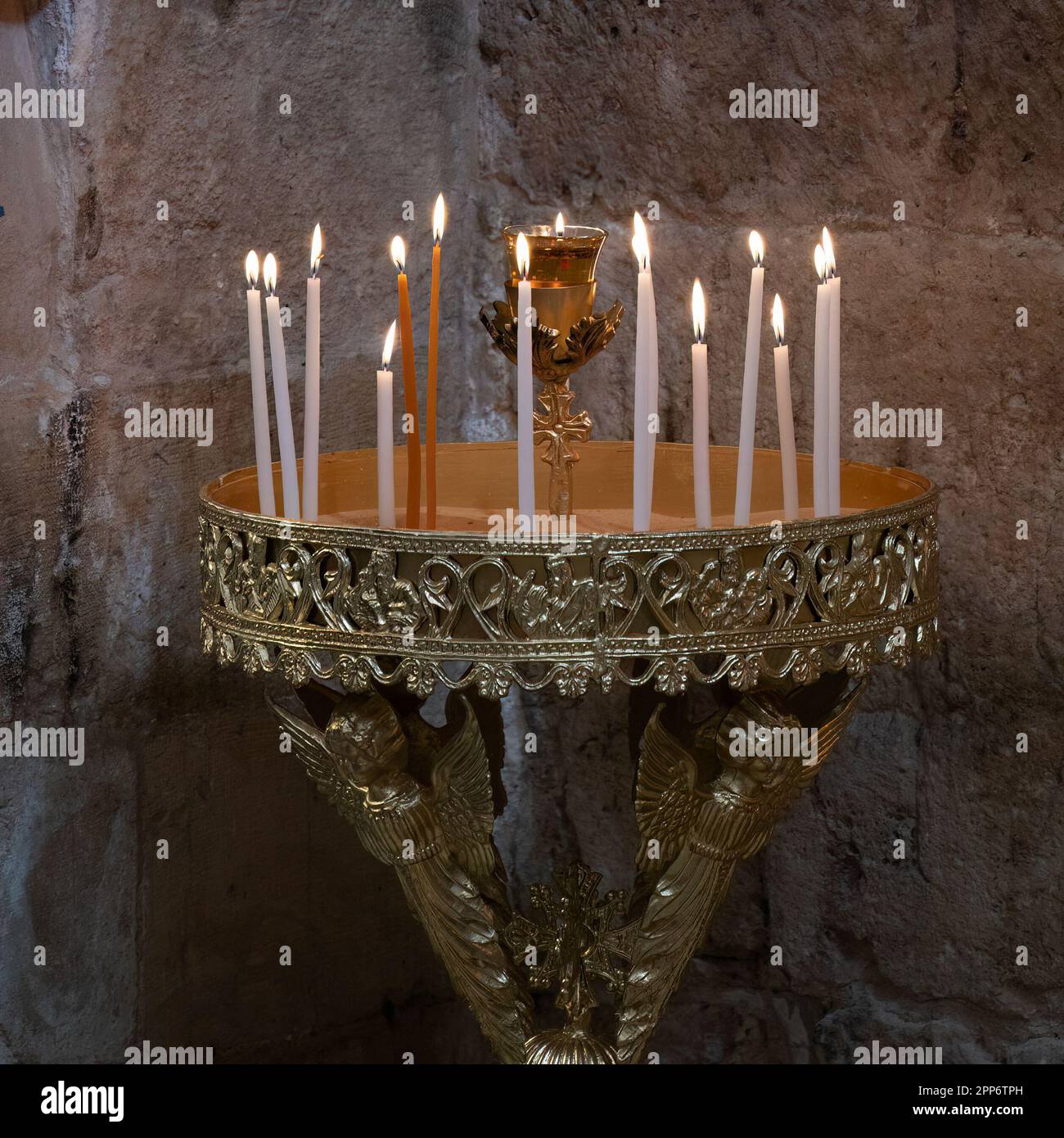 Multiple burning prayer candles hi-res stock photography and images - Alamy