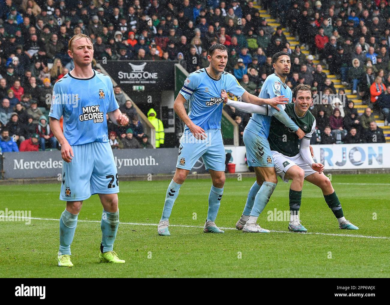 Callum Wright #26 of Plymouth Argyle battles for possession during the ...