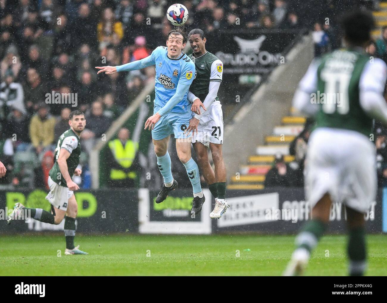 Nigel Lonwijk #21 of Plymouth Argyle battles in the air during the Sky ...