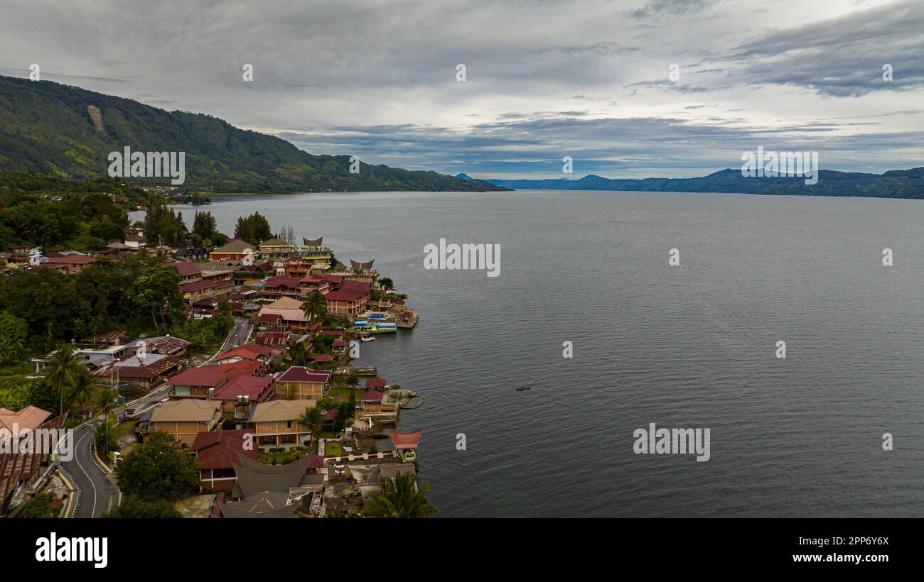 Aerial view of Lake Toba and Samosir Island. Tuk Tuk traditional ...