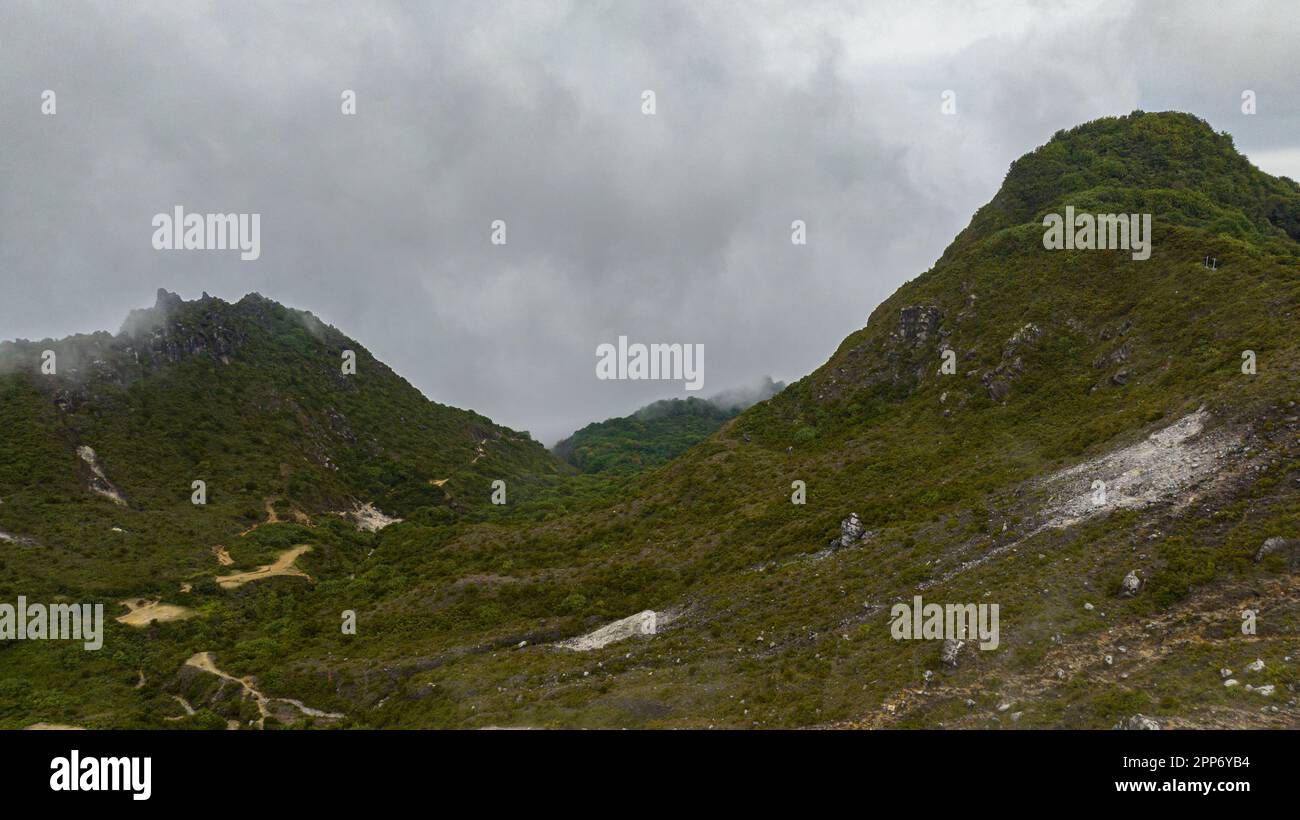 Mountain slopes covered with rainforest and jungle view from above ...