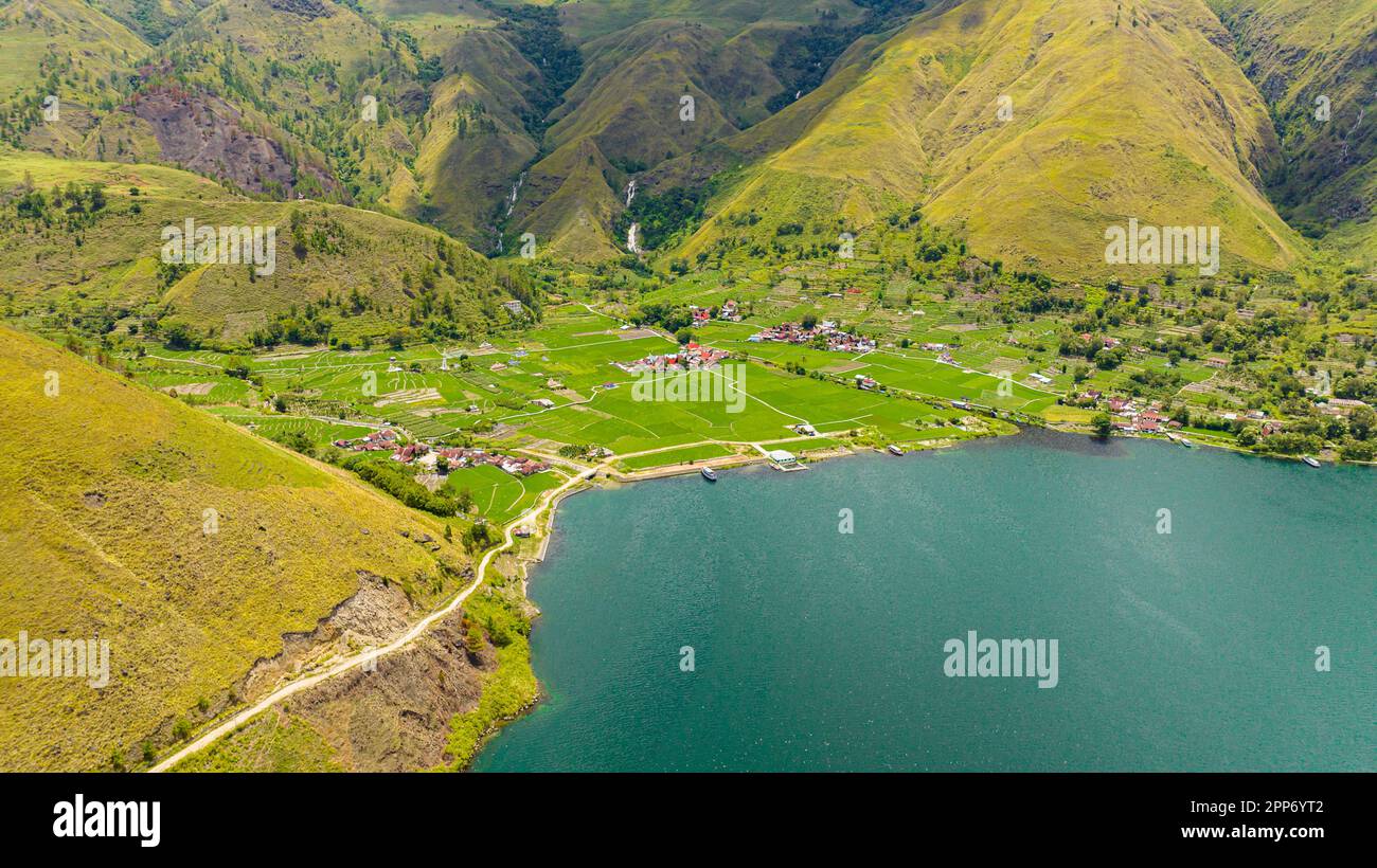Aerial view of Farmland in a mountain valley on Lake Toba. Sumatra ...